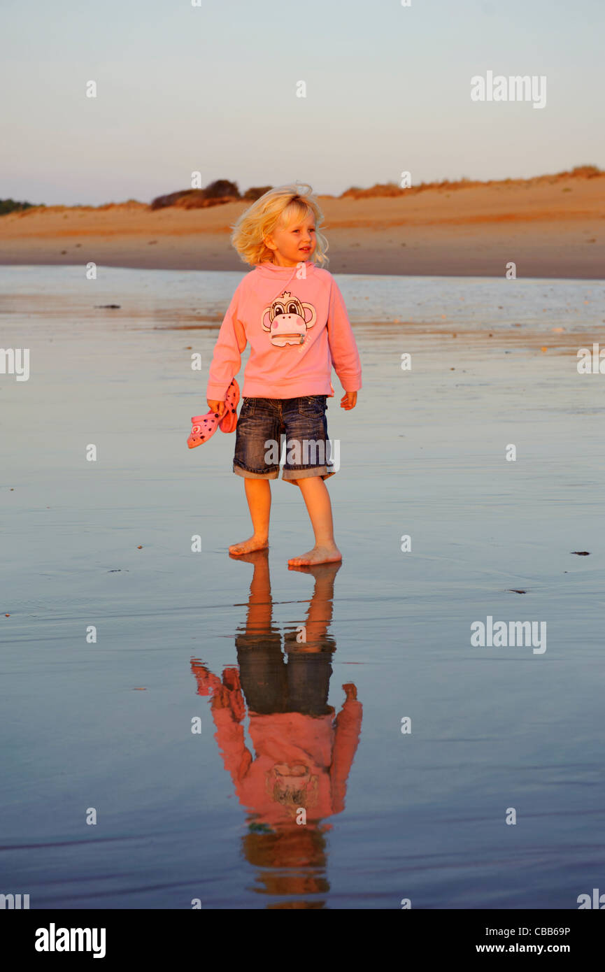 Stock photo of a six year old girl walking on the beach Stock Photo - Alamy