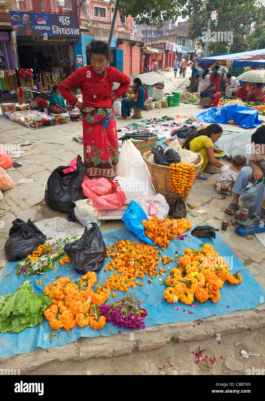 Old lady selling flowers kathmandu hi-res stock photography and images ...