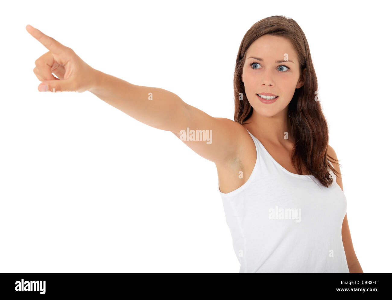 Attractive young woman pointing to the side. All on white background ...