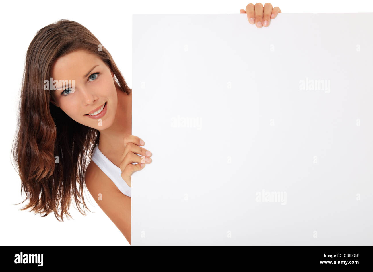 Attractive young woman behind a blank white sign. All on white ...