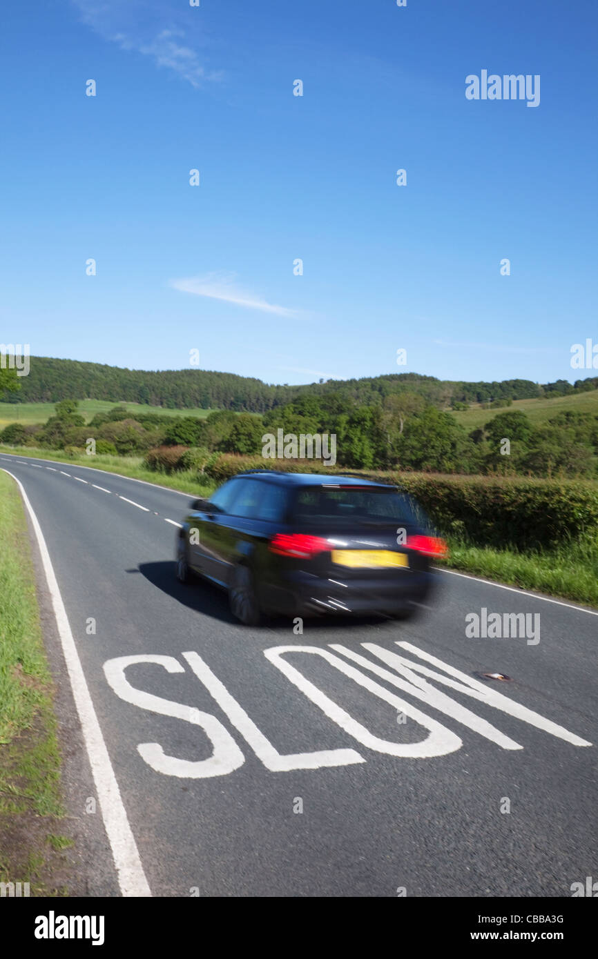 England, Road and Slow Sign Stock Photo - Alamy
