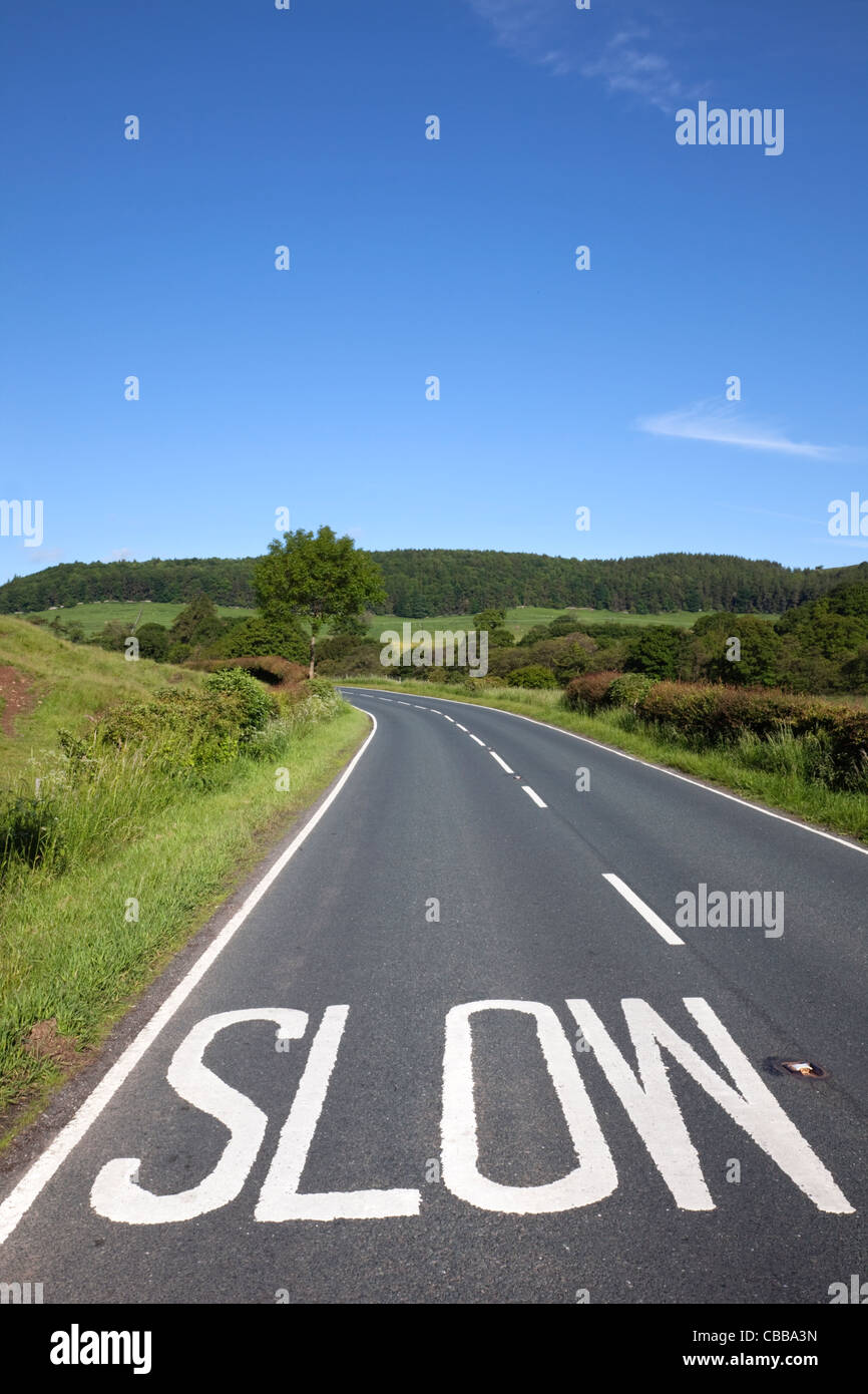 England, Road and Slow Warning Sign Stock Photo - Alamy