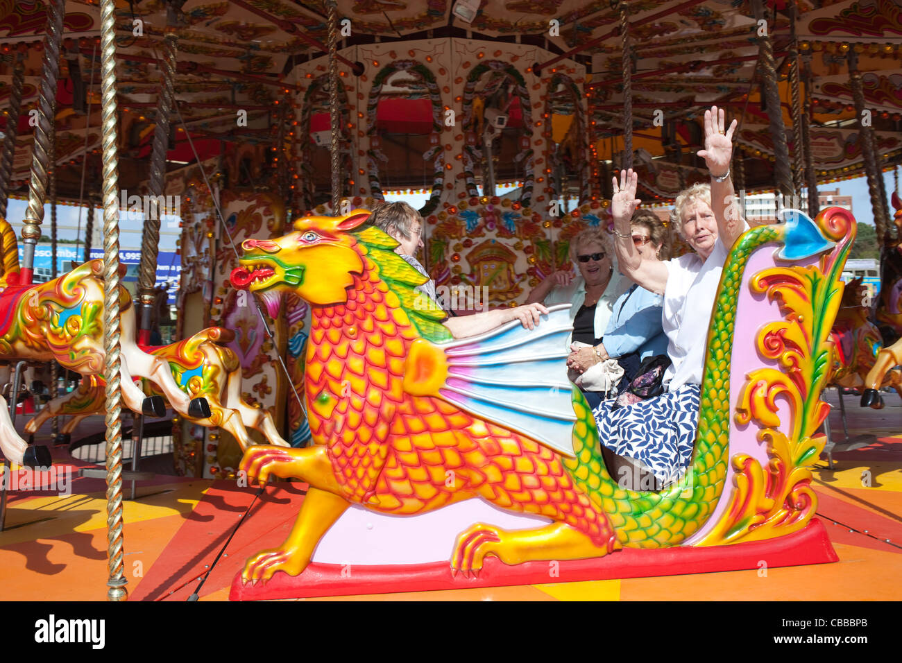 England, Bournmouth, Lady Pensioners on a Carousel Stock Photo - Alamy