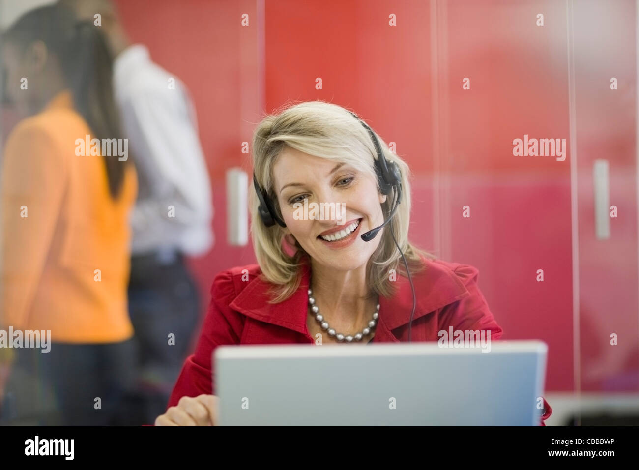 Mature businesswoman using personal computer hi-res stock photography ...