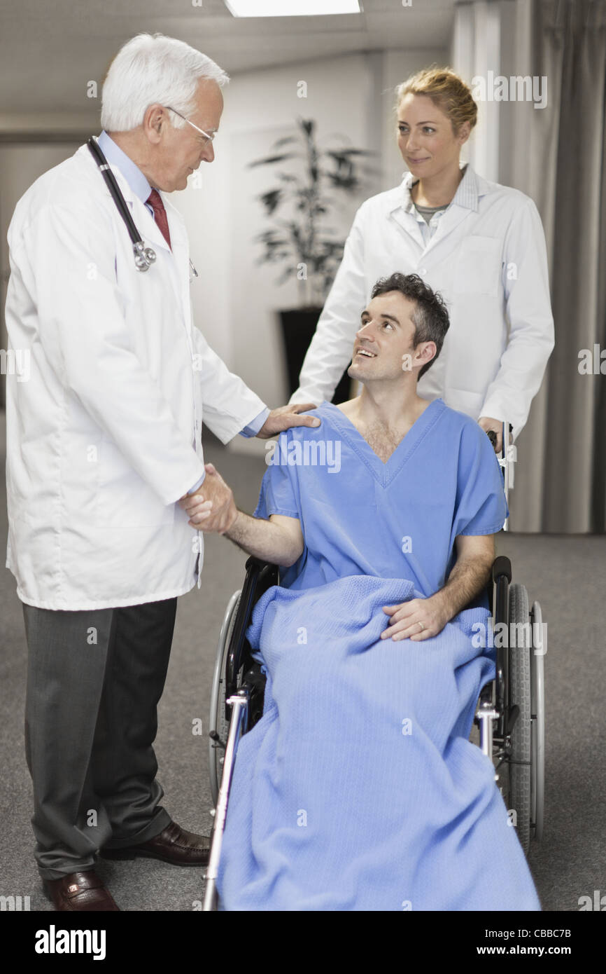 Doctor shaking patient’s hand Stock Photo - Alamy