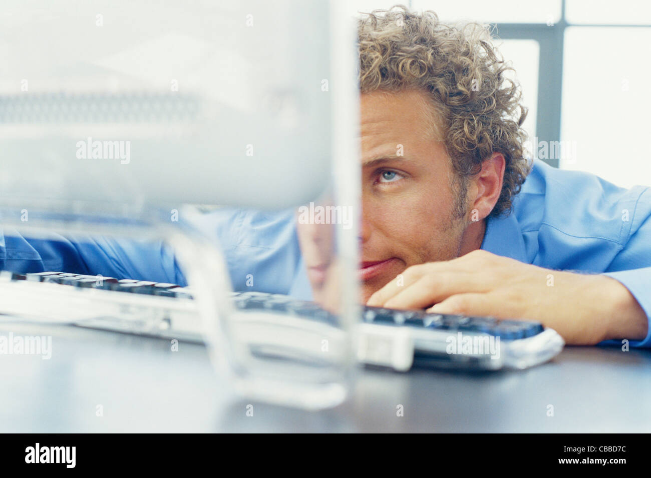 Bored businessman resting on desk Stock Photo - Alamy