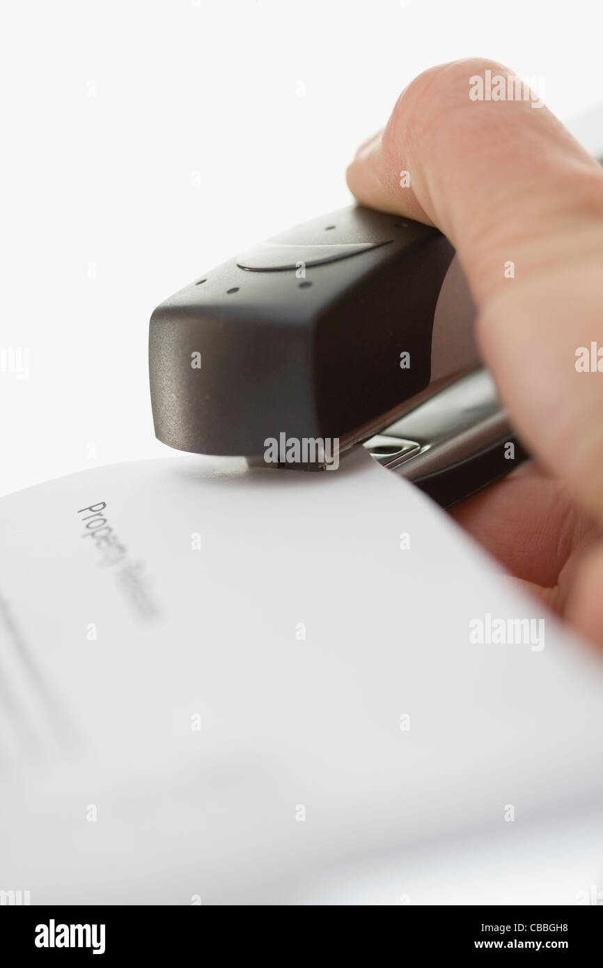 Person using stapler hi-res stock photography and images - Alamy
