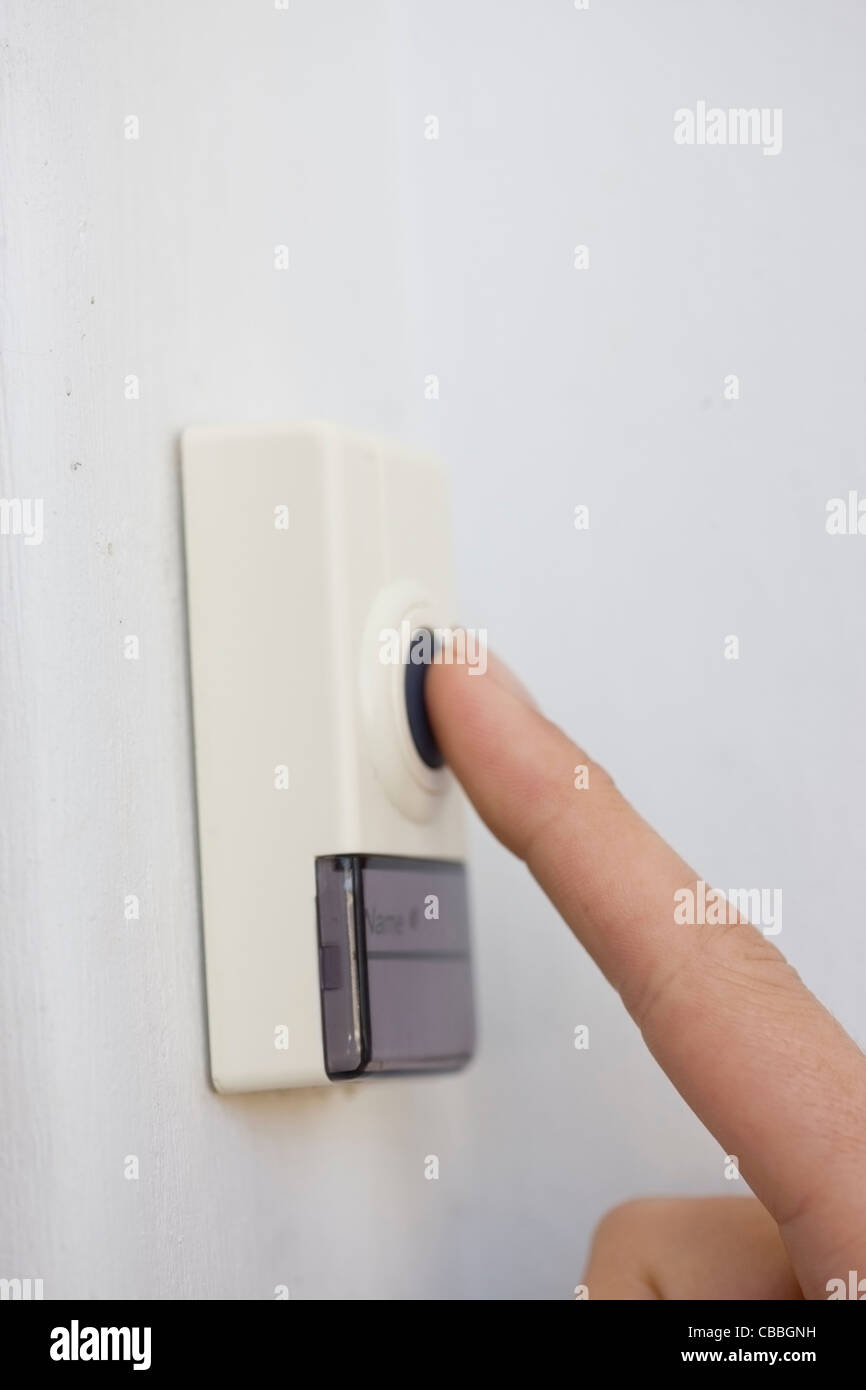 Woman pressing button Stock Photo - Alamy
