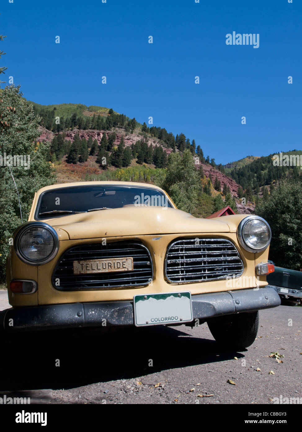 Old yellow car parked on the street of Telluride, Colorado Stock Photo ...