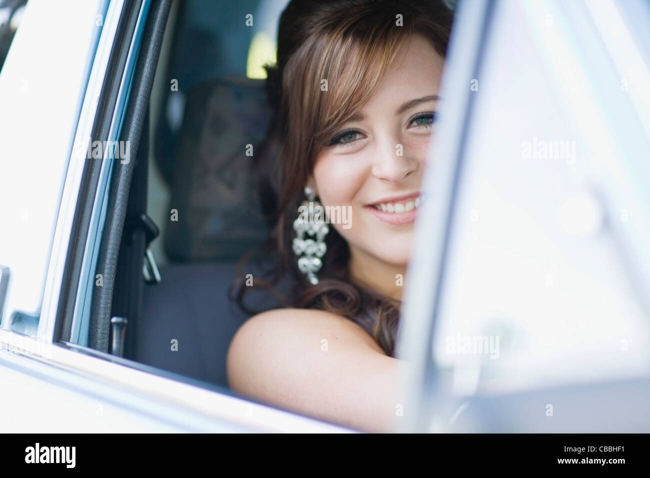 Teenage girl smiling in car Stock Photo - Alamy