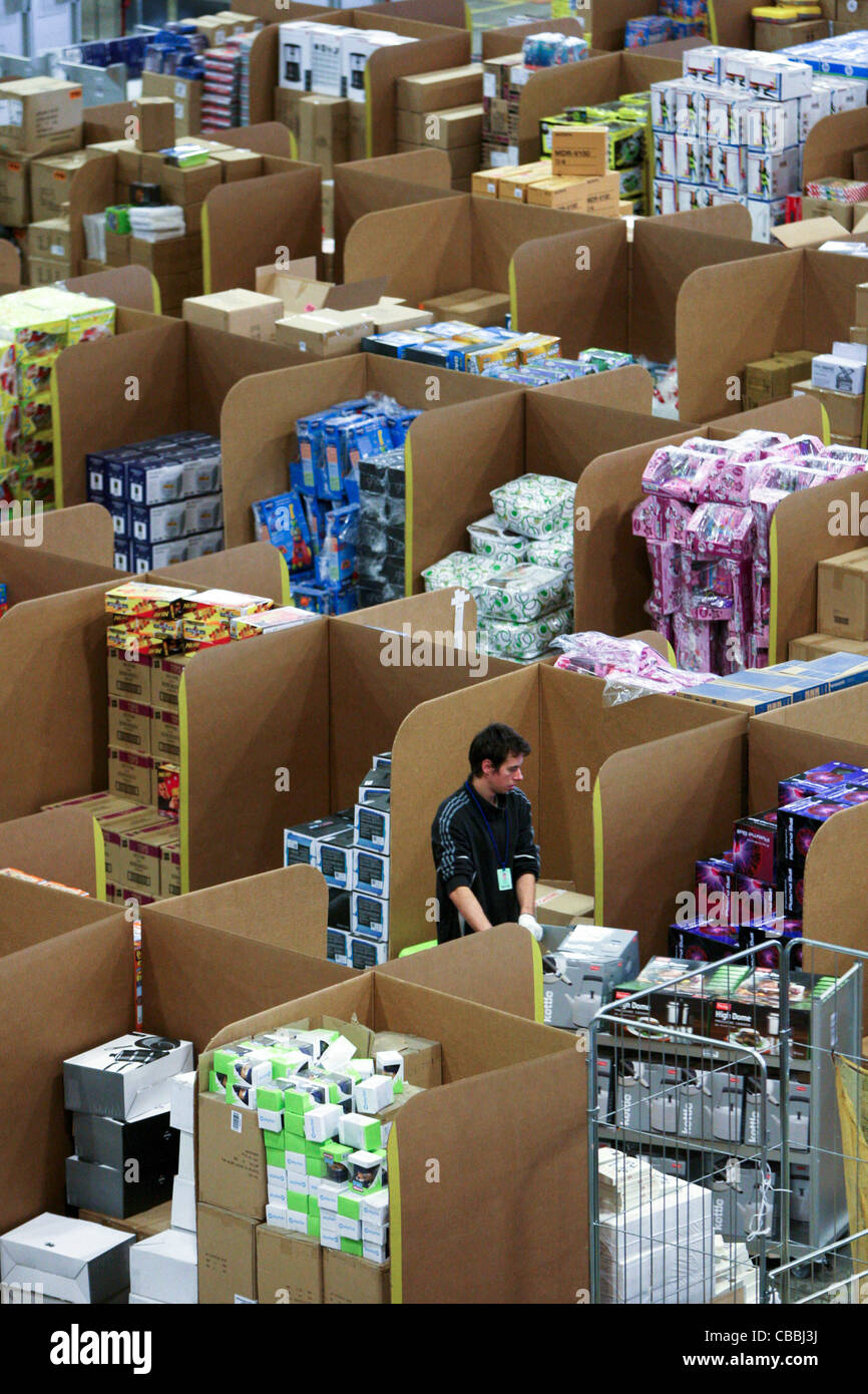 WORKERS SORTING CHRISTMAS PRESENTS AT THE AMAZON WAREHOUSE IN MILTON ...