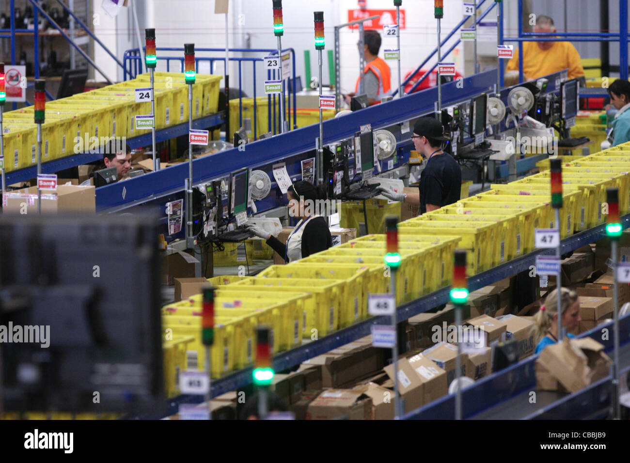 WORKERS SORTING CHRISTMAS PRESENTS AT THE AMAZON WAREHOUSE IN MILTON ...