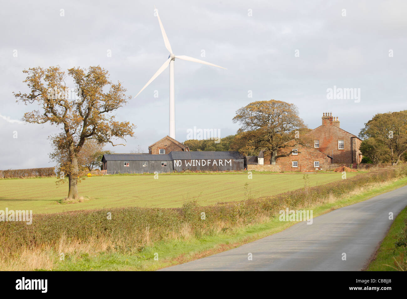 No Windfarm protest sign painted on farm buildings, Cumwhinton Road ...