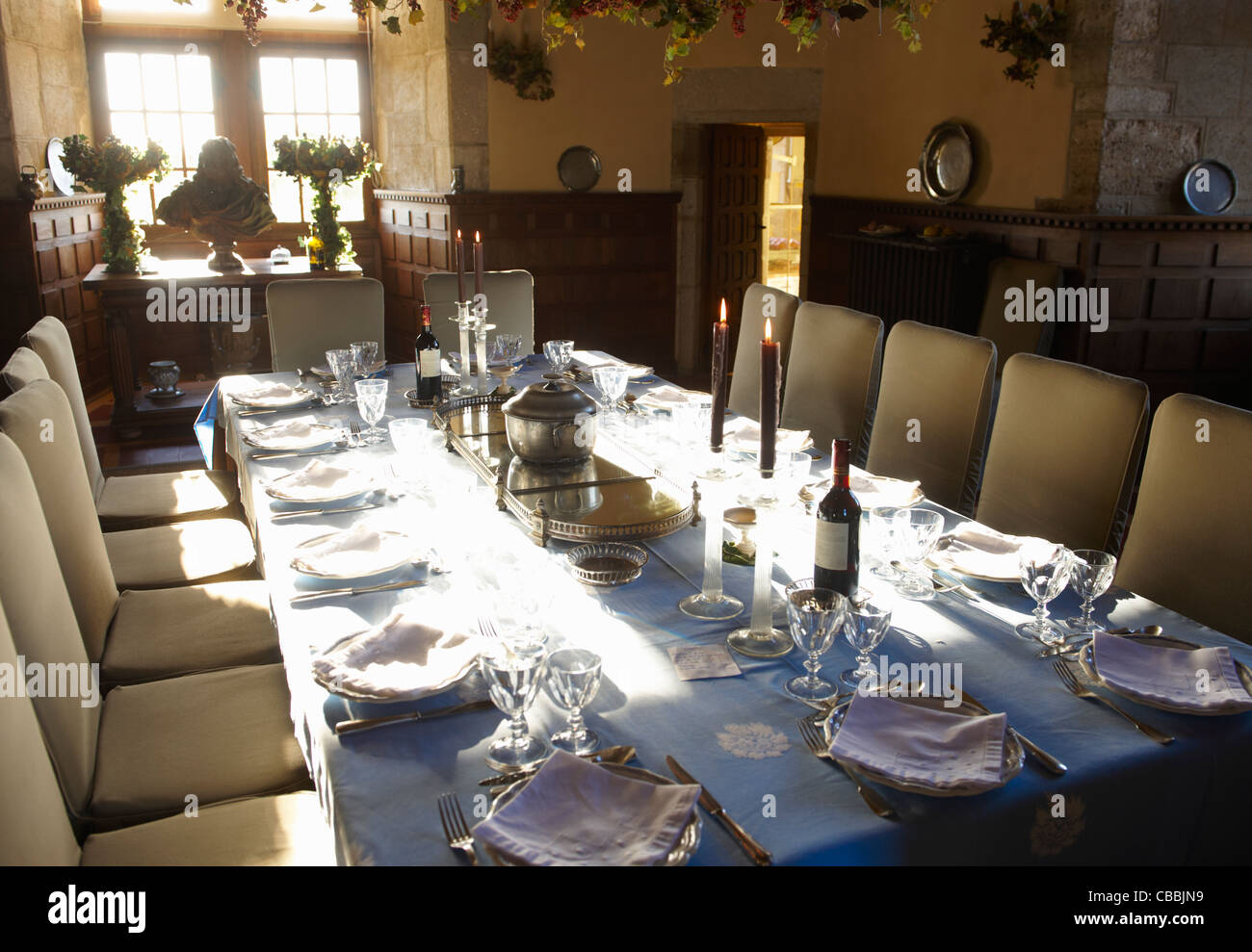 Ornate table settings in dining room Stock Photo - Alamy