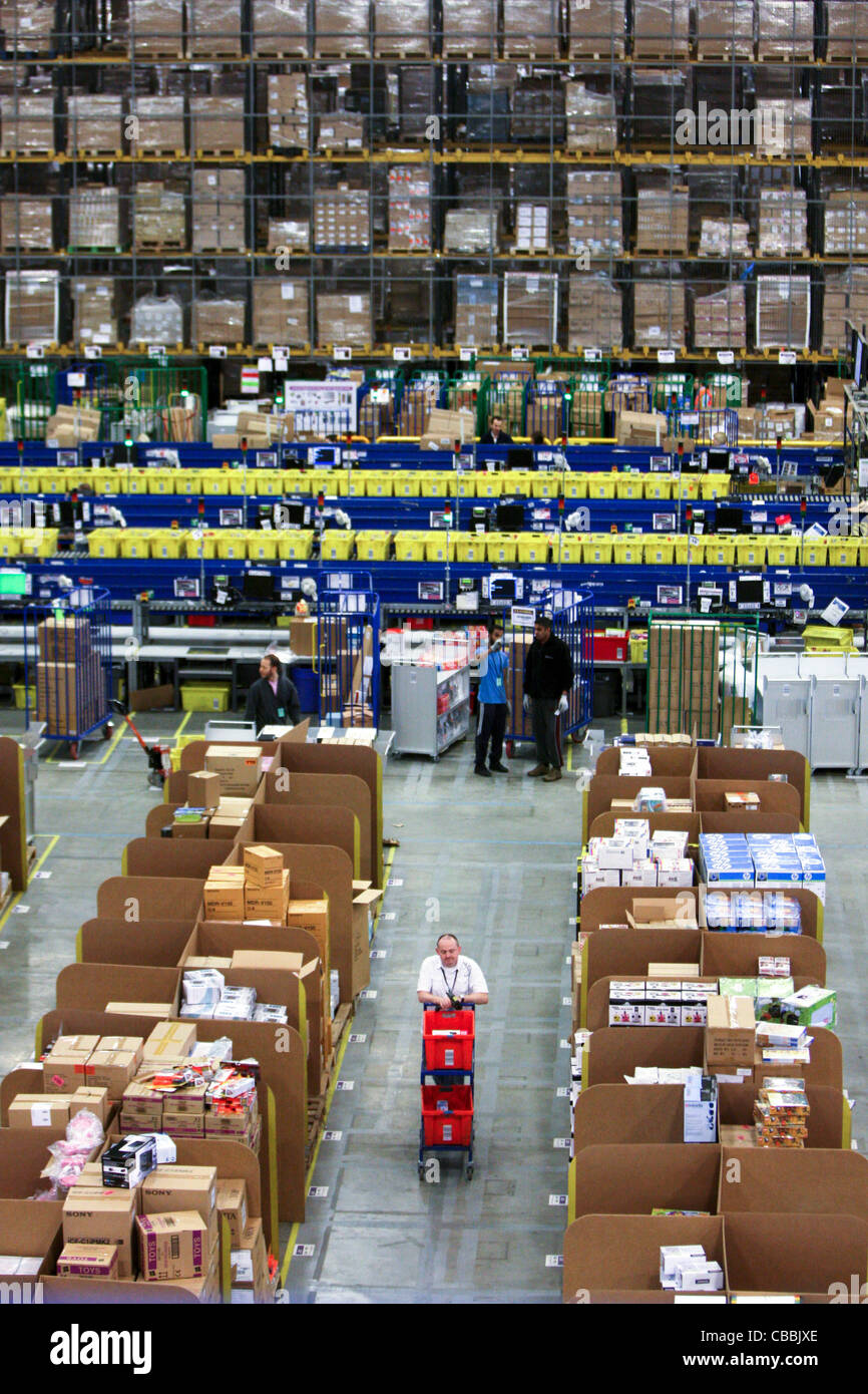 WORKERS SORTING CHRISTMAS PRESENTS AT THE AMAZON WAREHOUSE IN MILTON ...