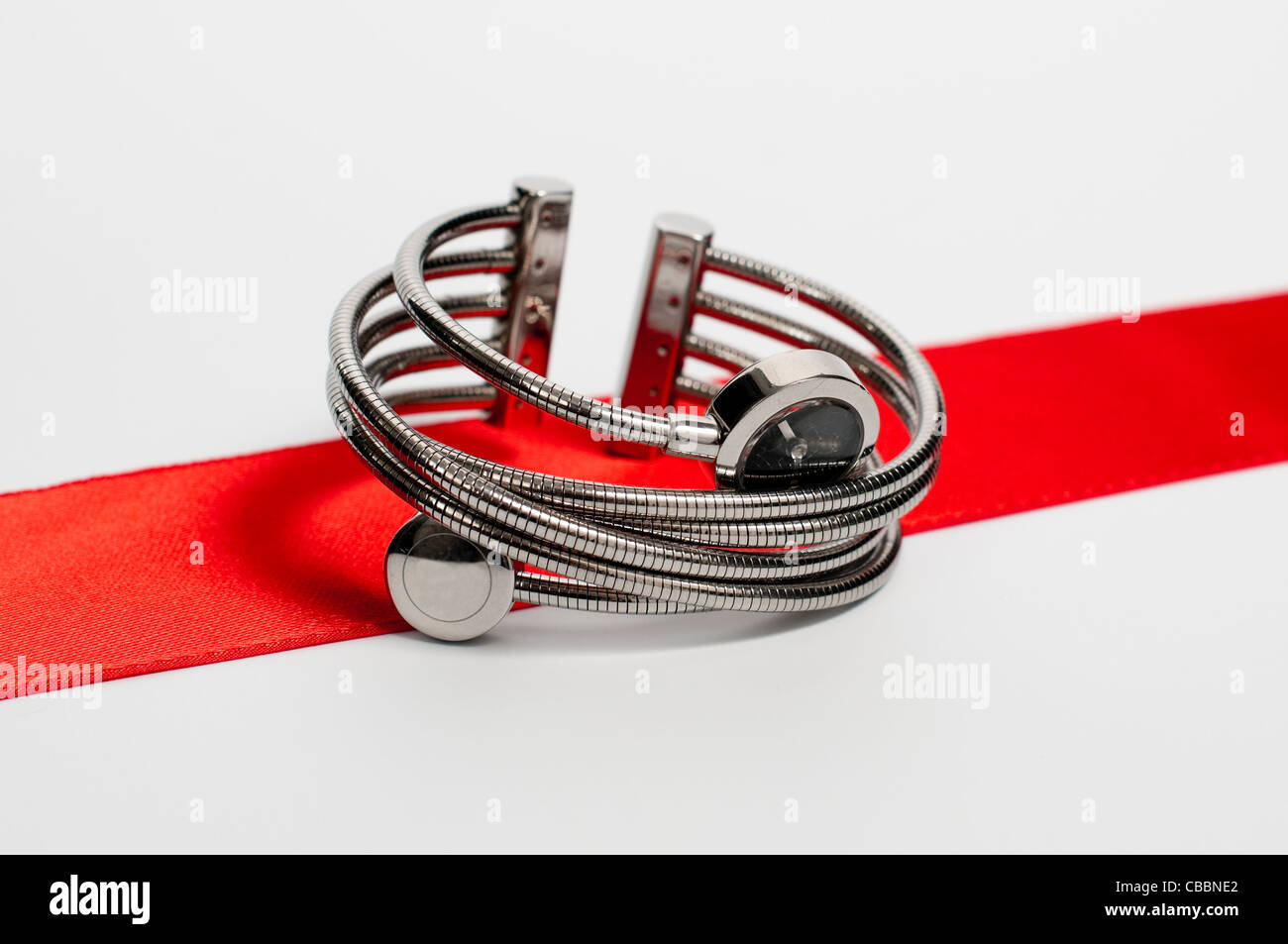 close up photo of femail fashion watches on a red stripe Stock Photo ...