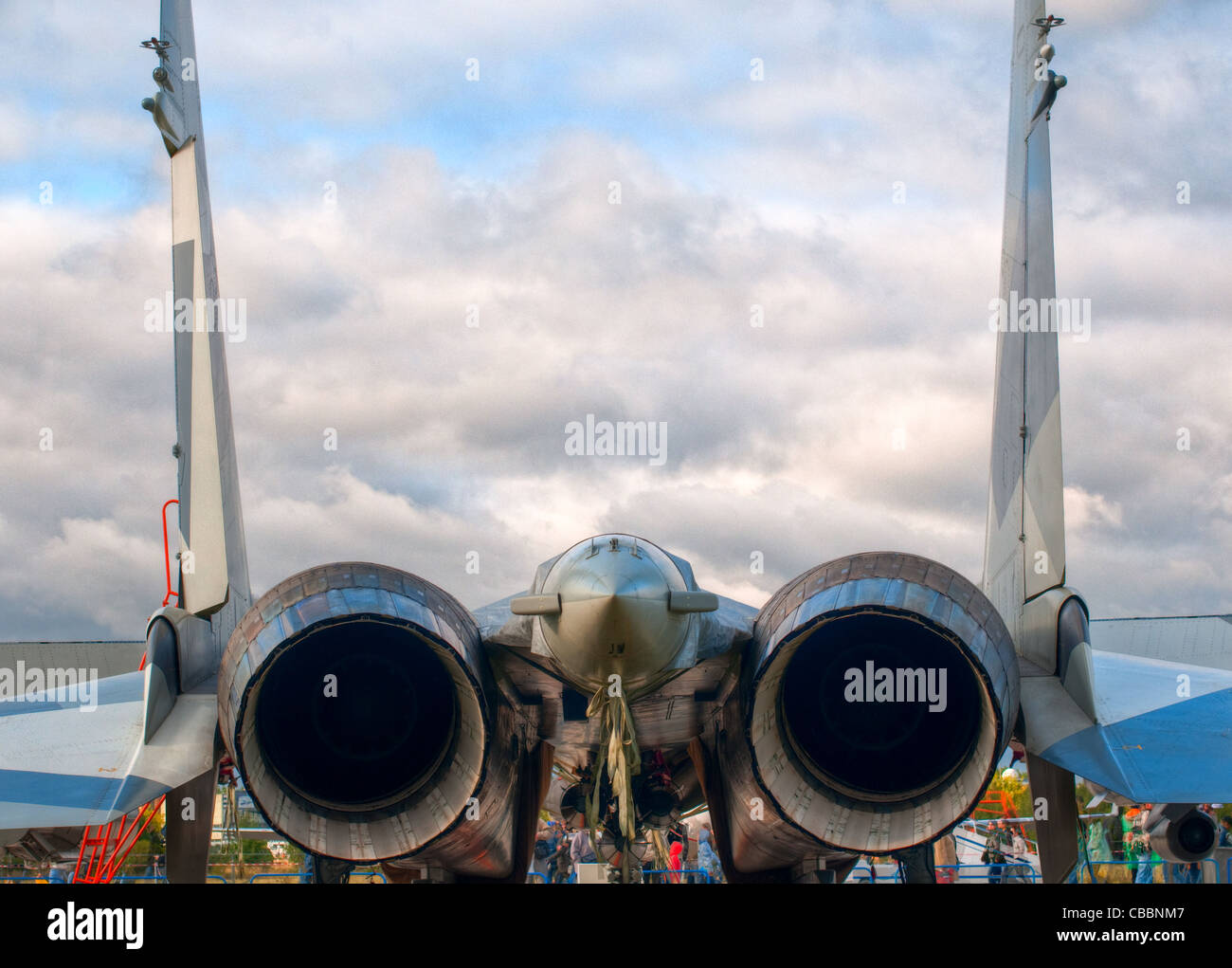 rear detailed view of air fighter on the ground with blue sky in ...