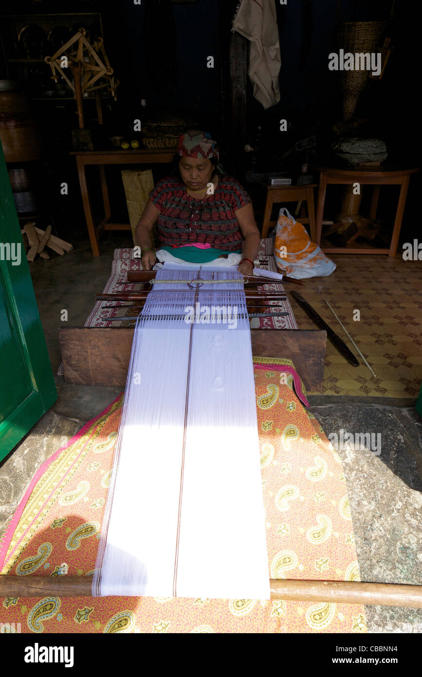 Woman weaving cloth using traditional hand loom, Birethanti village ...
