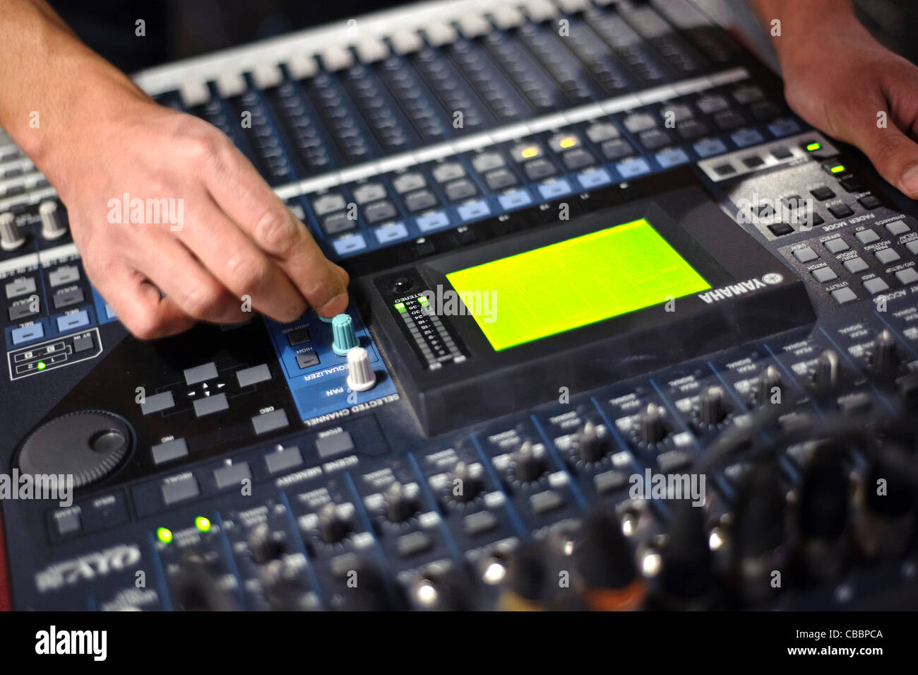 Music dj adjusts sound mixer hi-res stock photography and images - Alamy