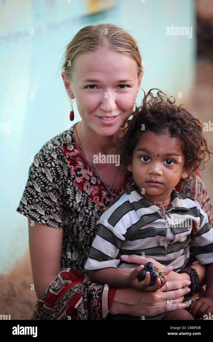 Little orphan child held by a foreigner woman Andhra Pradesh South ...