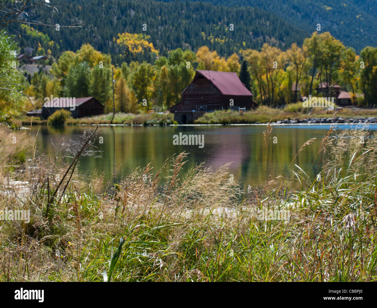 Old barn by the lake in autumn. Near Lake City, Colorado Stock Photo ...