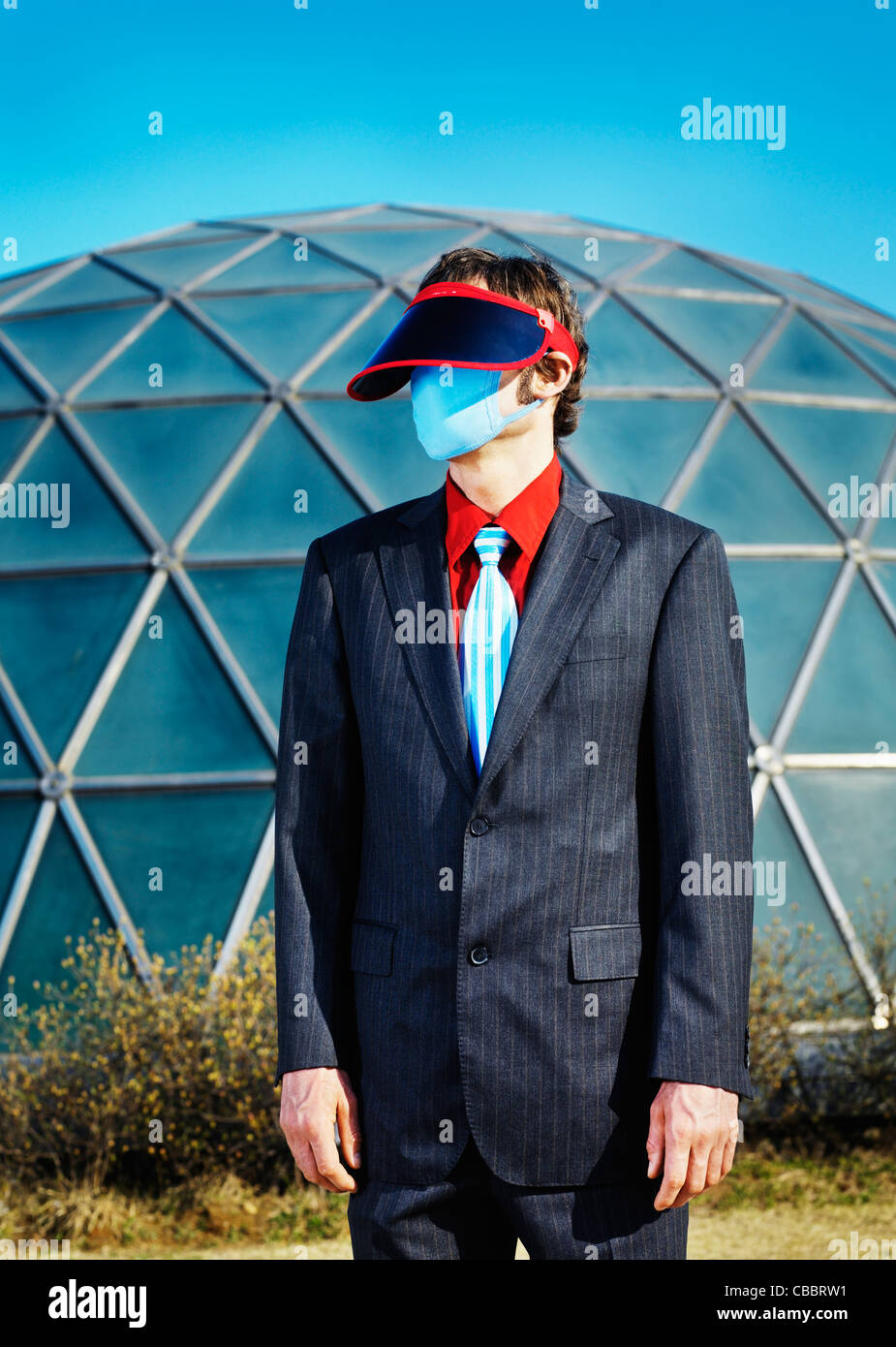 Businessman wearing visor and mask Stock Photo - Alamy