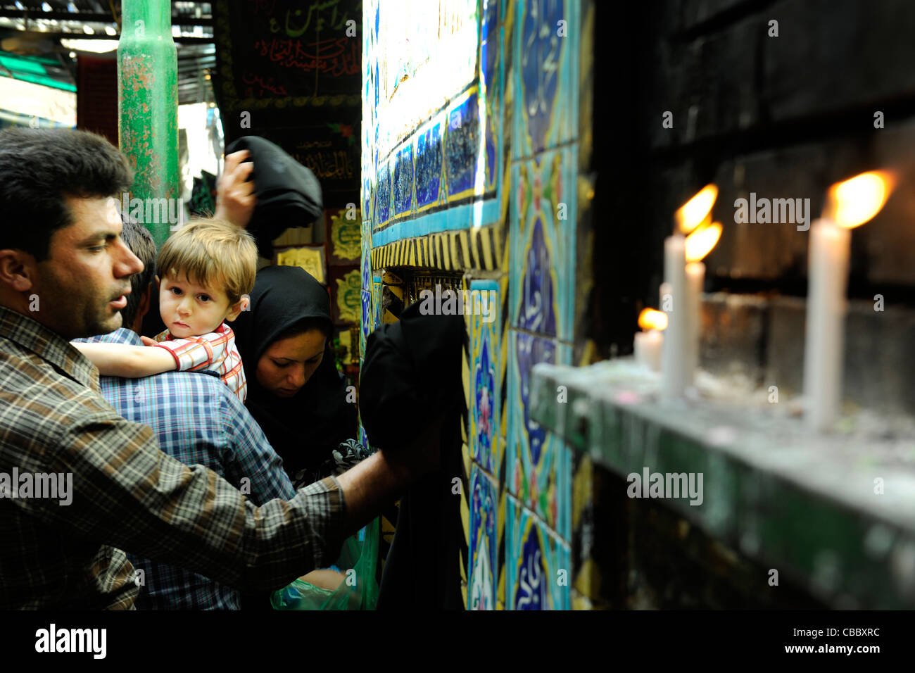 Iraq, Kerbala. Prayer by faithful Shia Muslims at one of many shrines ...