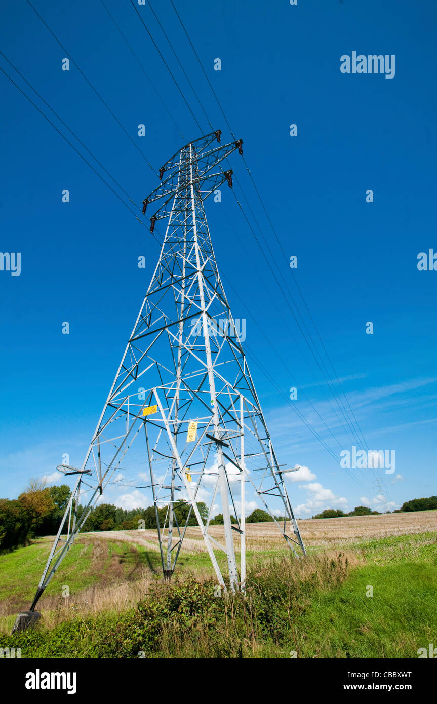 Electricity Pylon Transmission Tower in countryside against a blue sky ...