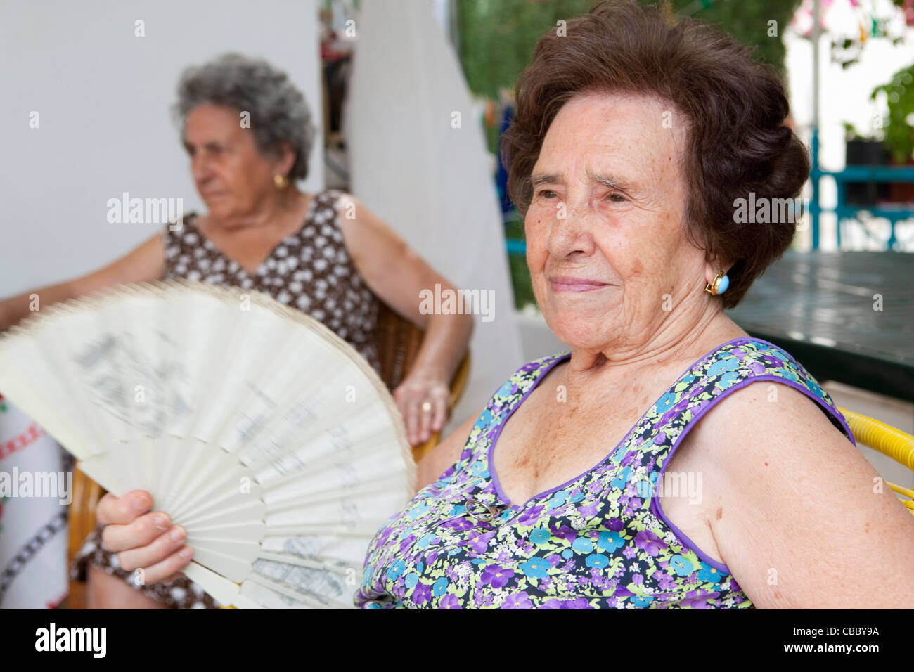 Woman fanning herself hi-res stock photography and images - Alamy