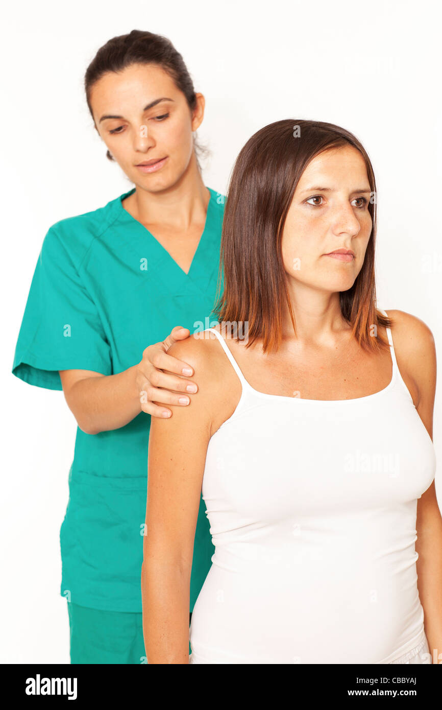 Shoulder inspection by a female doctor Stock Photo - Alamy
