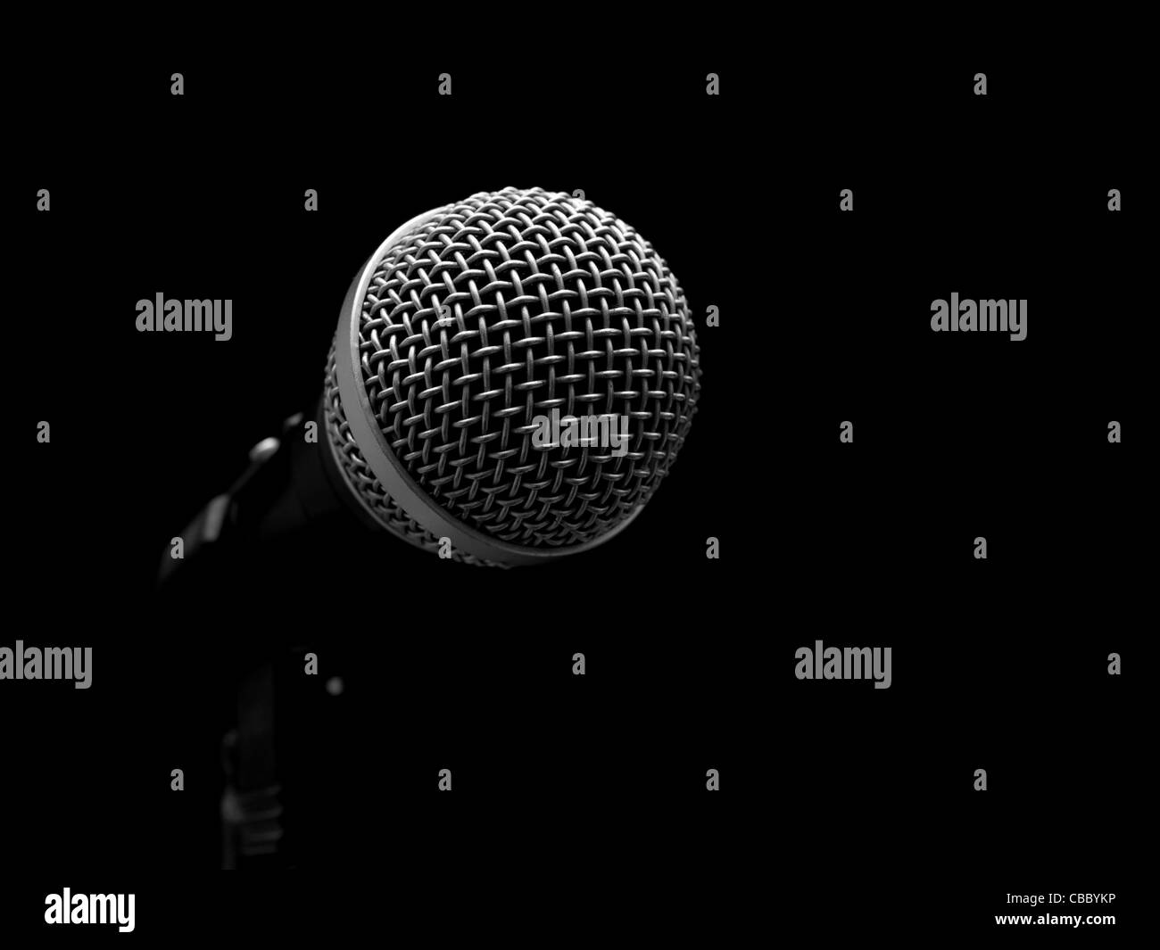 Dynamic microphone isolated on black Stock Photo - Alamy