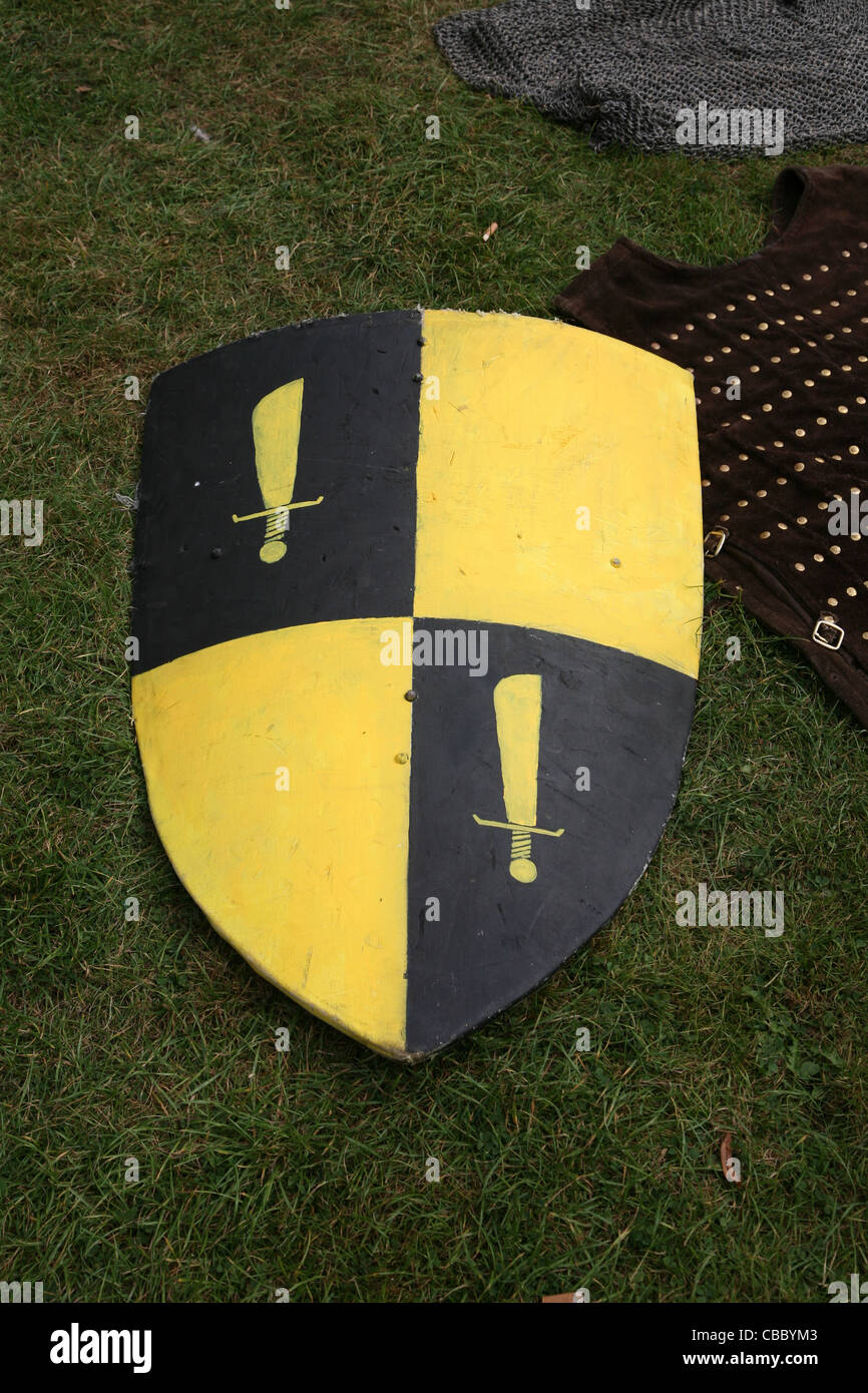 A black and yellow shield belonging to a re-enactor of medieval battles ...