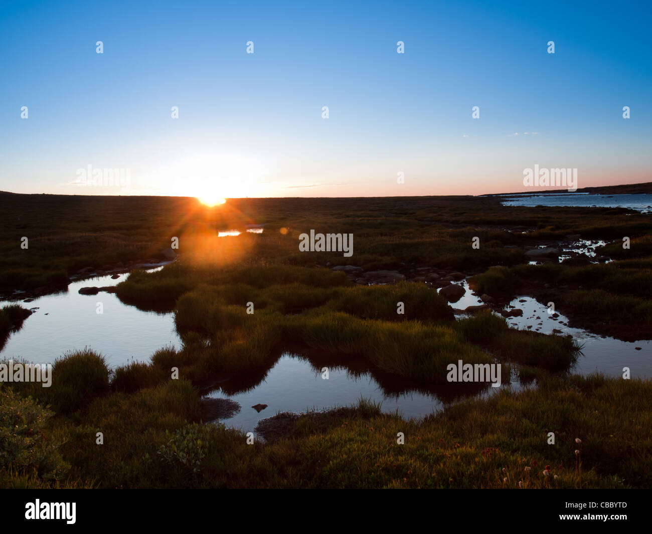 Beautiful Summit Lake reflects towering Mt. Evans and is surrounded by ...