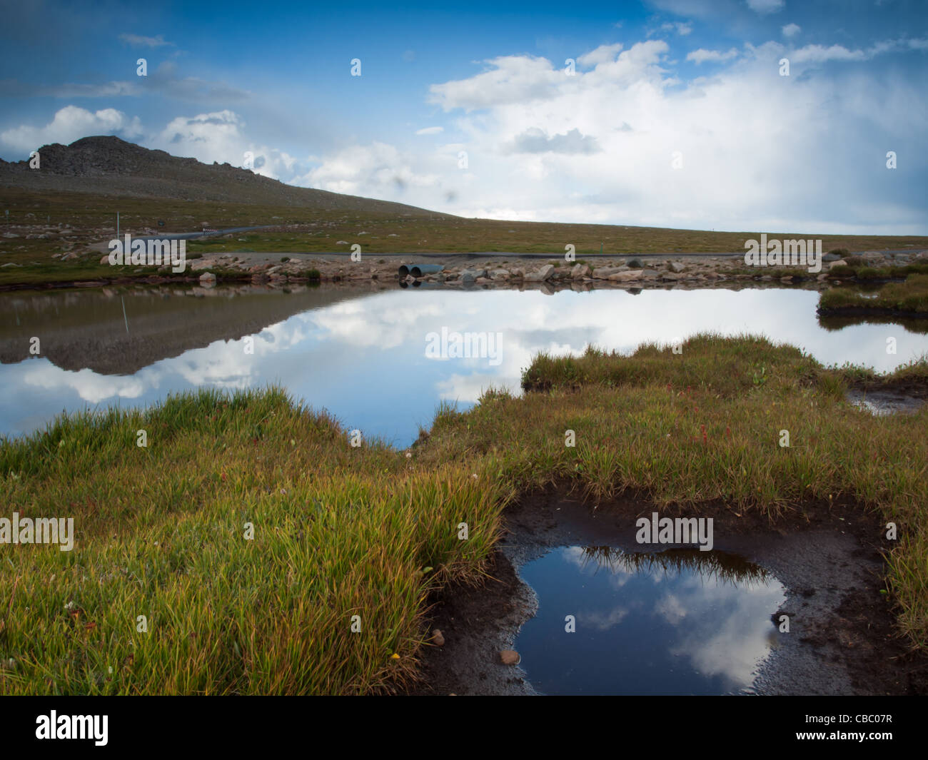 Beautiful Summit Lake reflects towering Mt. Evans and is surrounded by ...