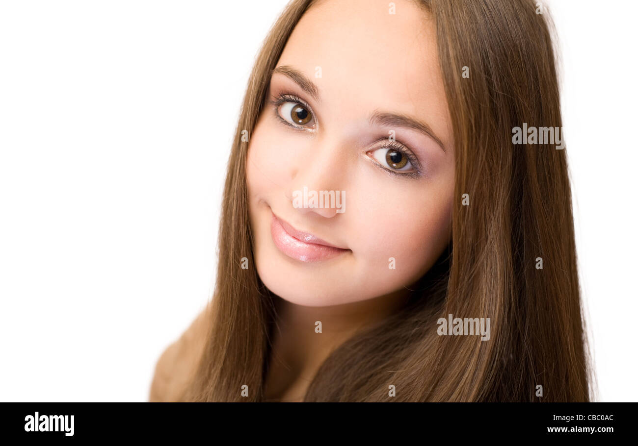 Closeup portrait of a friendly beautiful brunette isolated on white ...