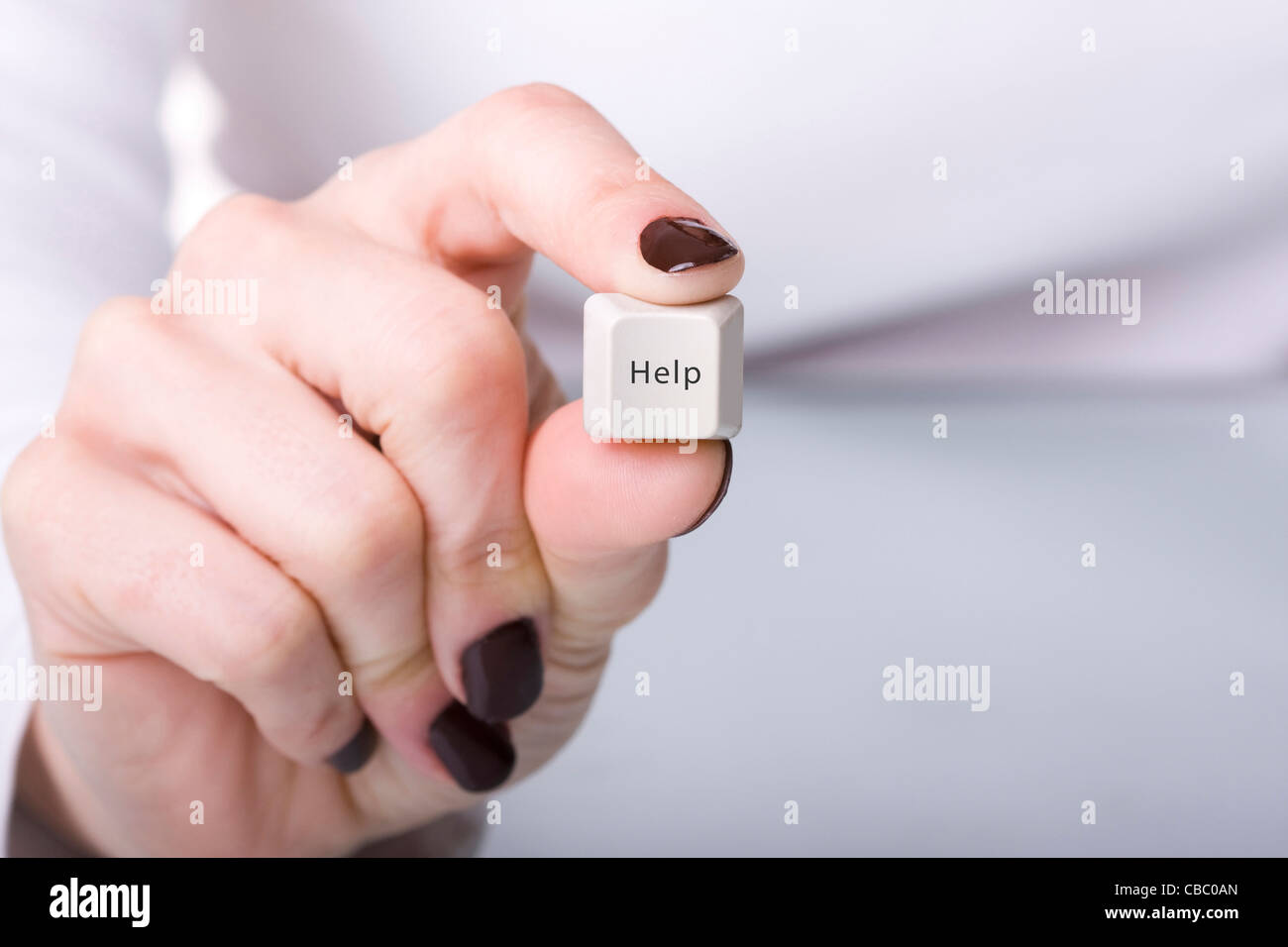 woman hand holding the Help key from the keyboard Stock Photo - Alamy
