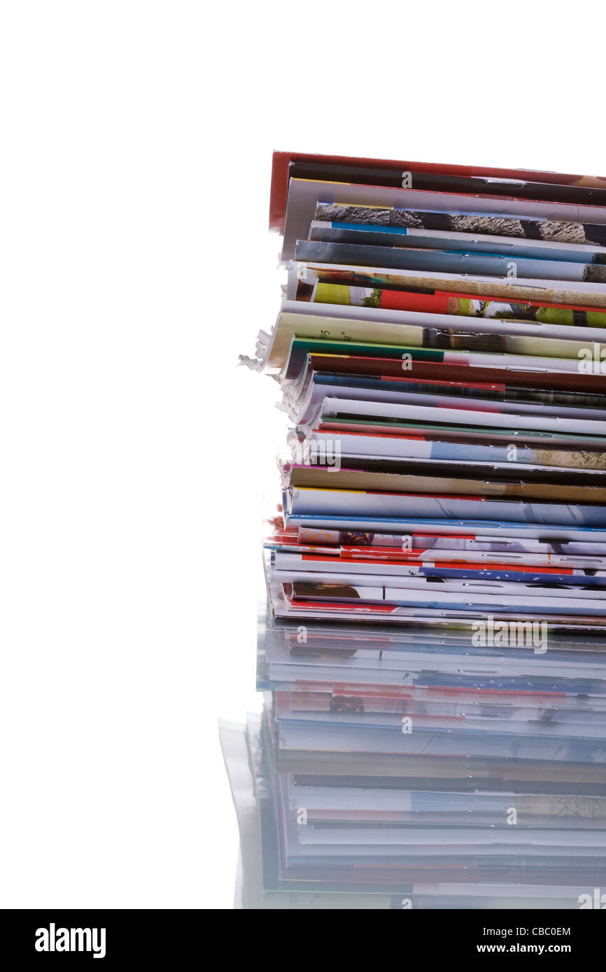 Stack of magazines isolated on white with reflection Stock Photo - Alamy