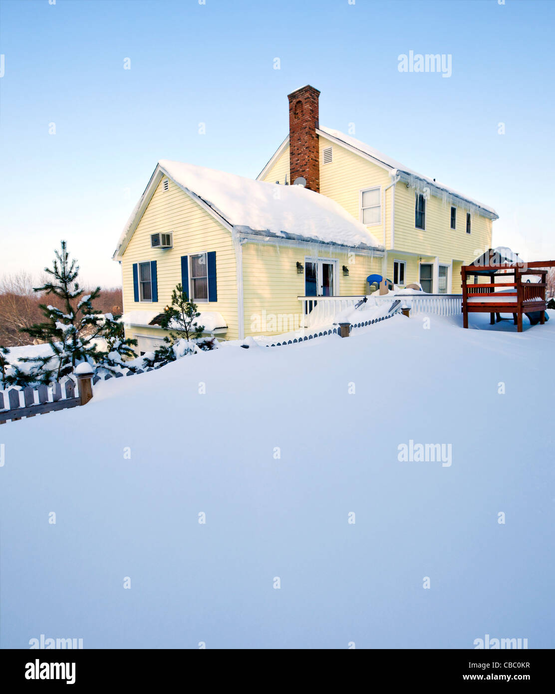 Typical colonial style house in deep snow and ice Stock Photo - Alamy