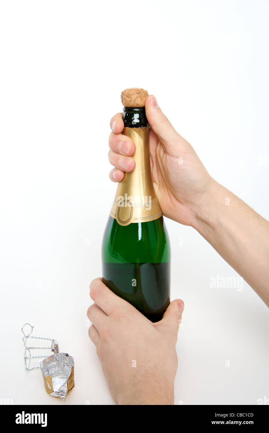 Opening bottle of champagne Stock Photo - Alamy