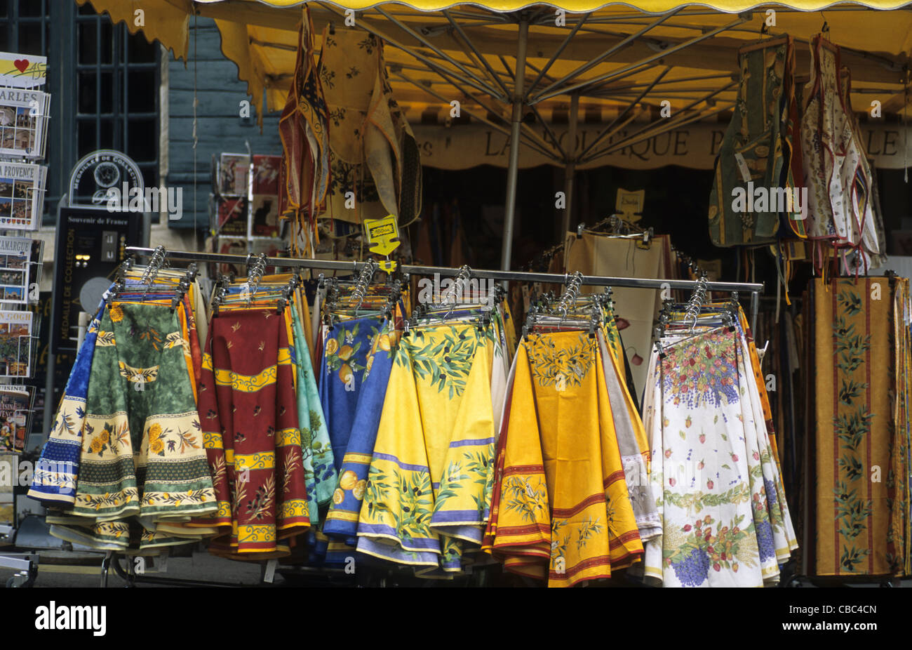 Traditional Provencal textiles in a market stall, Arles, France Stock ...