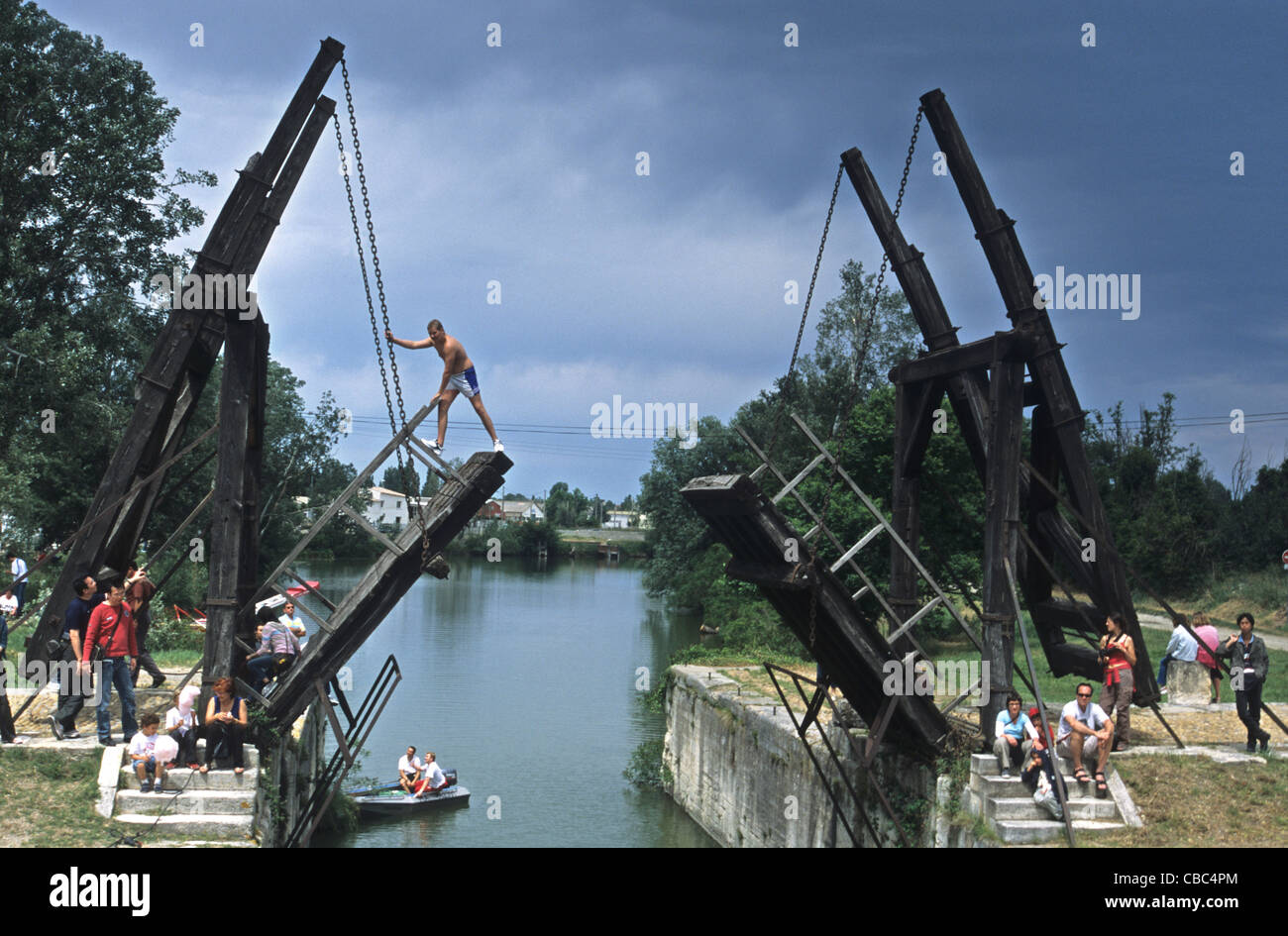 Boy jumping from bridge hi-res stock photography and images - Alamy