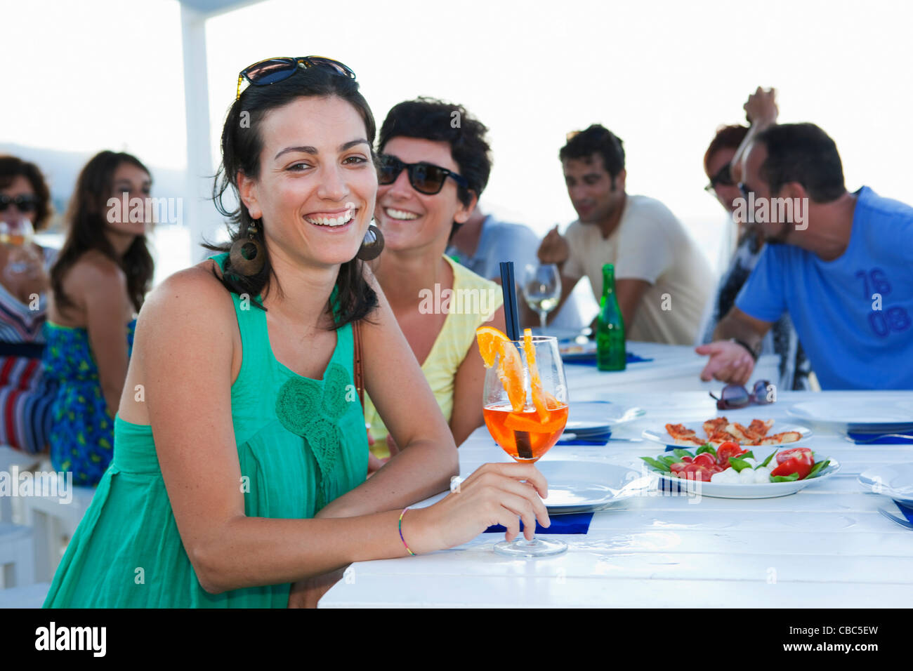 Women drinking alcohol table hi-res stock photography and images - Alamy