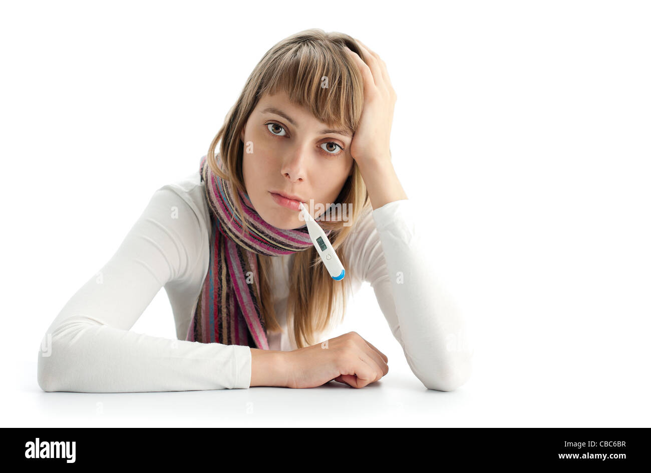 sad beautiful young woman with headache from the cold and thermometer ...