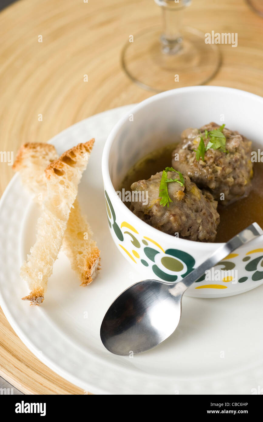 Poached meatballs with sage and lemon Stock Photo - Alamy