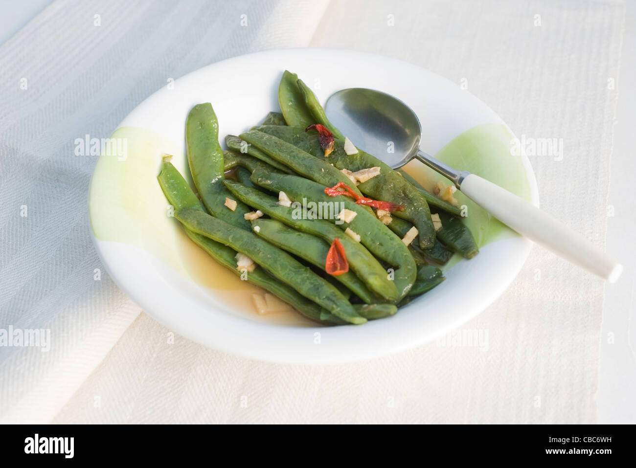 Runner beans with ginger and red peppers Stock Photo - Alamy