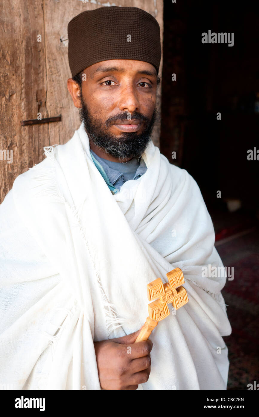 Orthodox Christian priest in a doorway of Debre Berhan Selassie Church ...