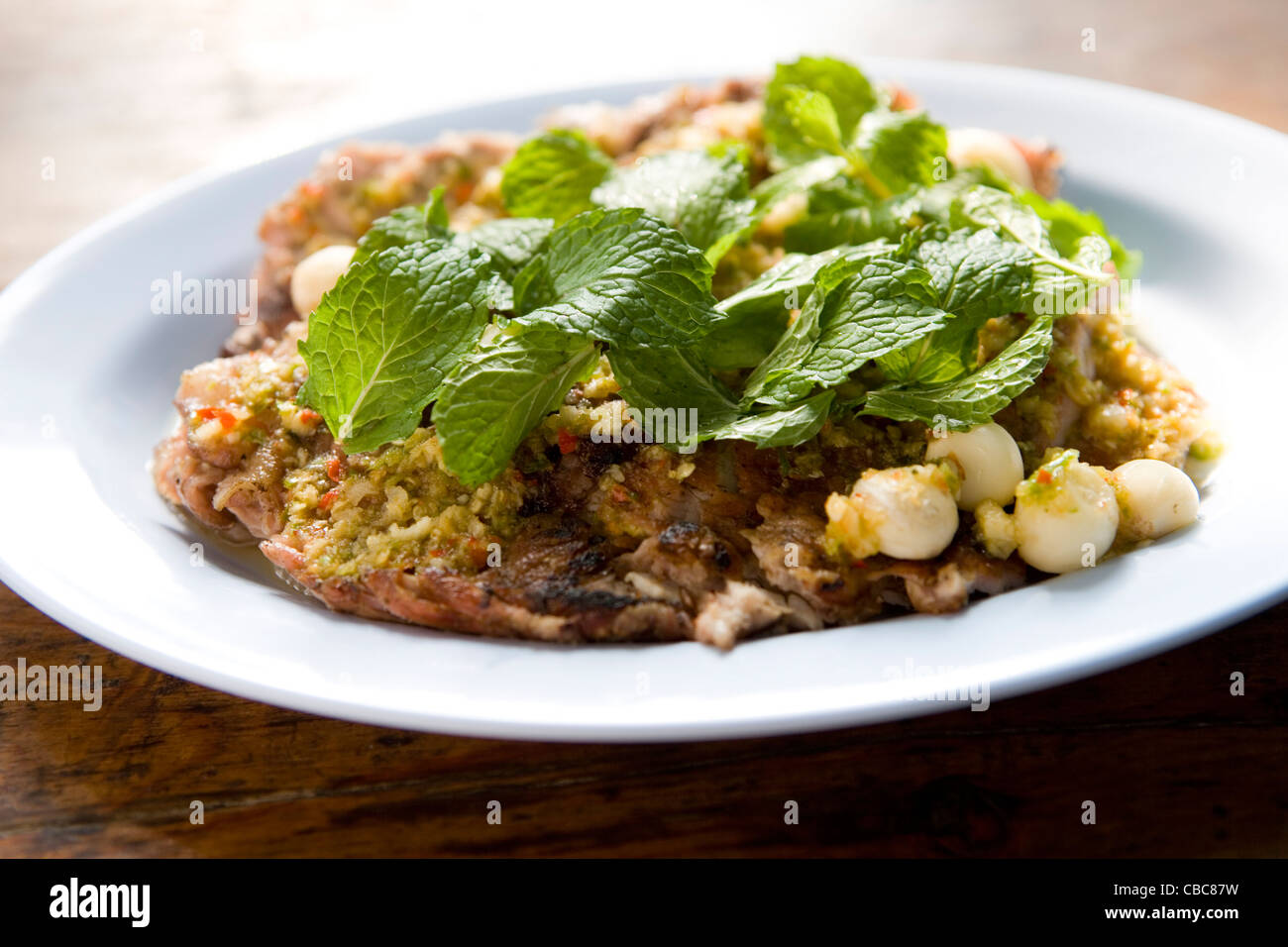 Spicy grilled pork with lemon Stock Photo - Alamy