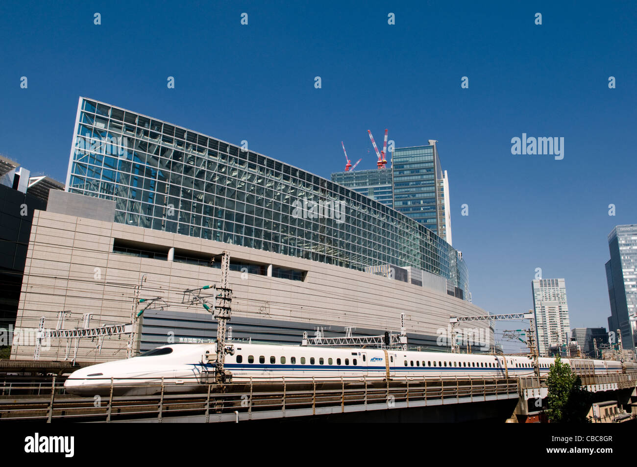 The shinkansen bullet train winding its way through downtown Tokyo ...