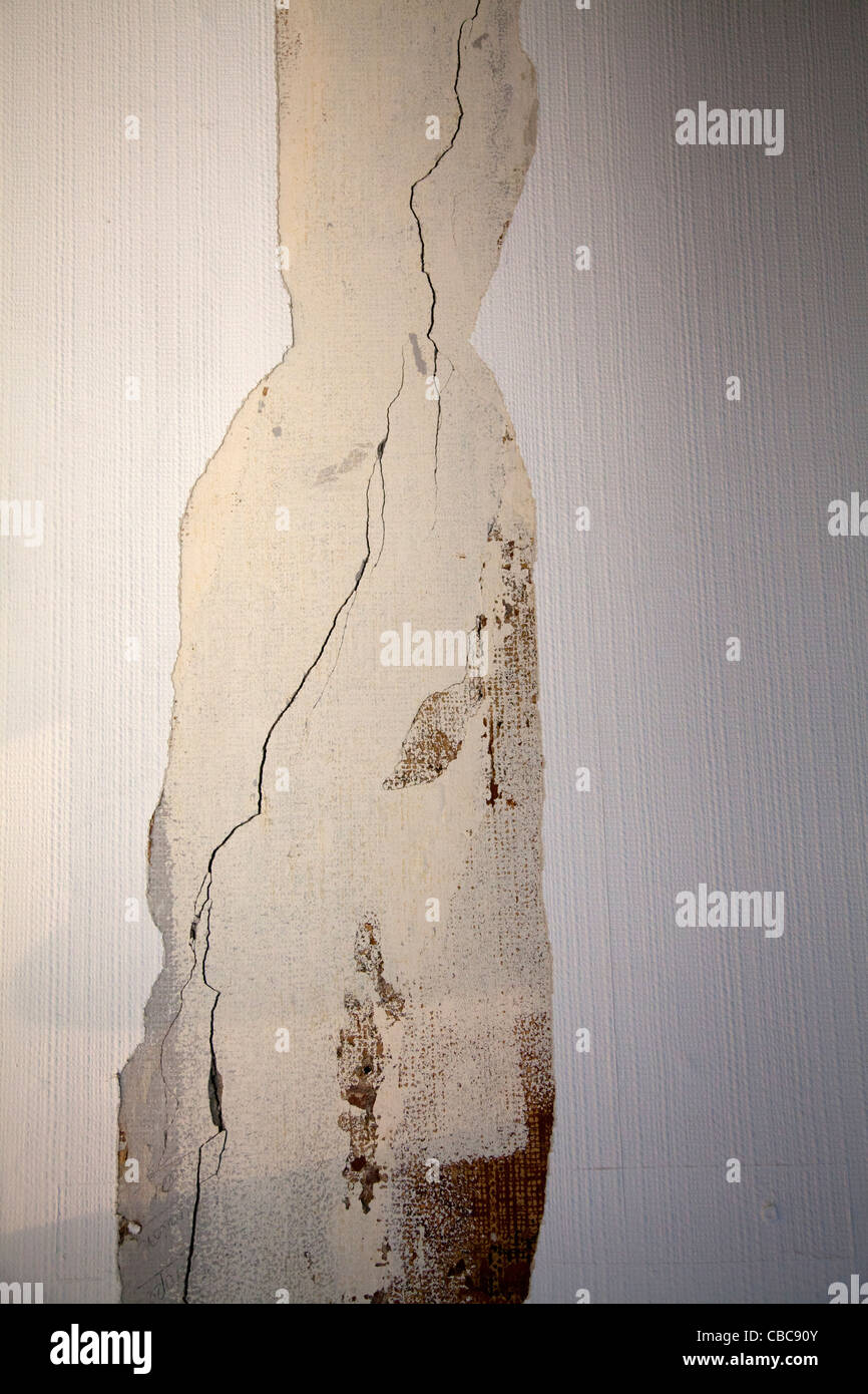 Wallpaper Peeled Back to Reveal Wall Crack Stock Photo - Alamy