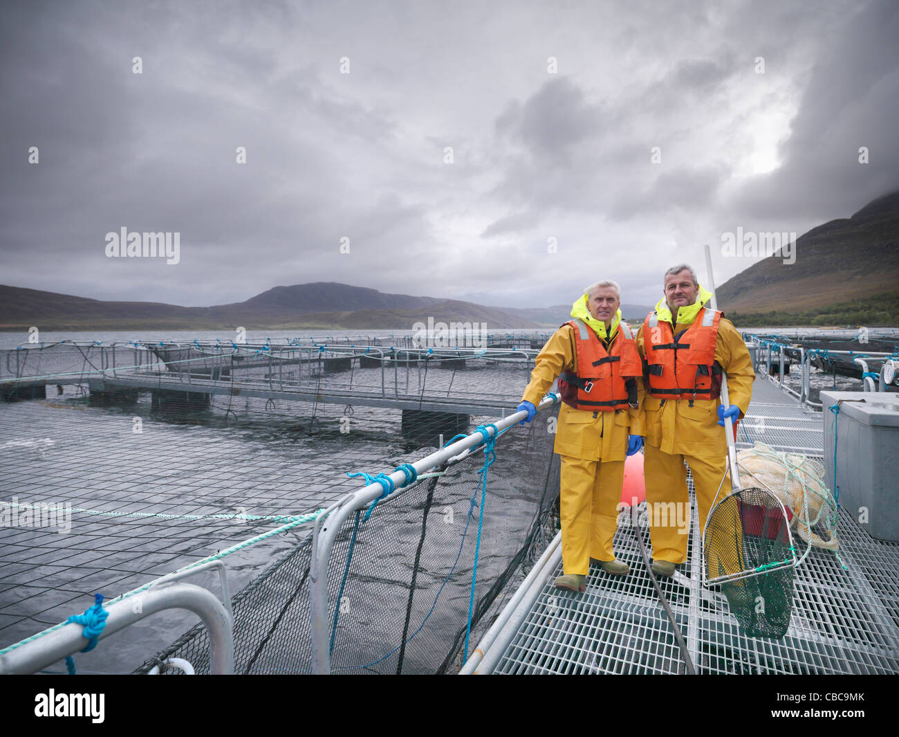 Salmon farm workers hi-res stock photography and images - Alamy